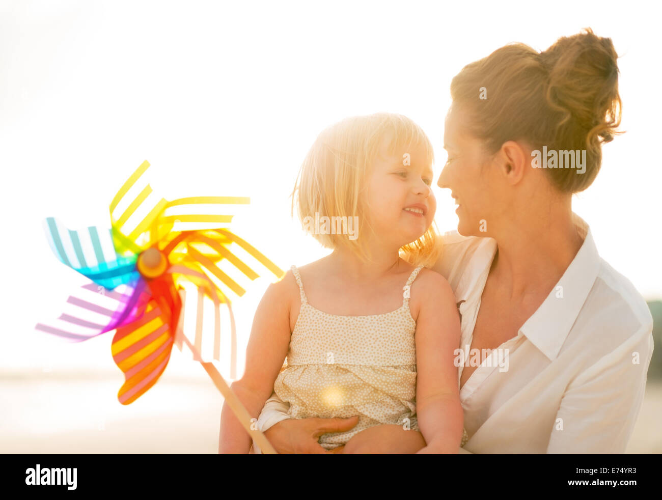 Baby holding windmill hi-res stock photography and images - Alamy