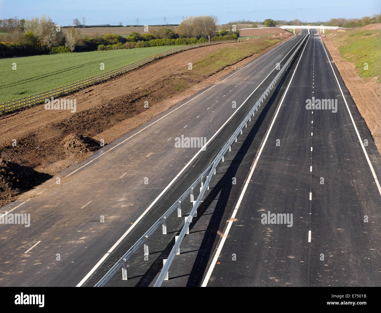A deserted new dual carriageway road not yet in use as it is ...