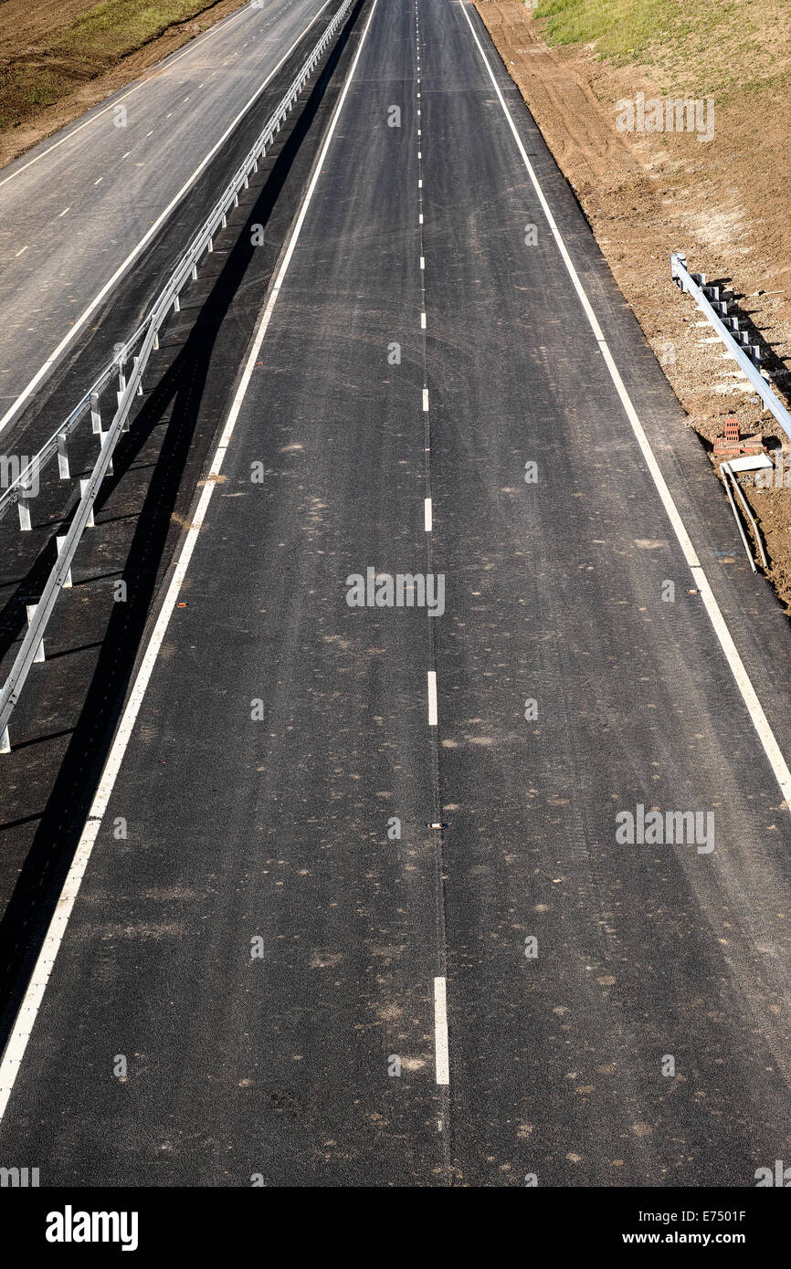 A deserted new dual carriageway road not yet in use as it is ...