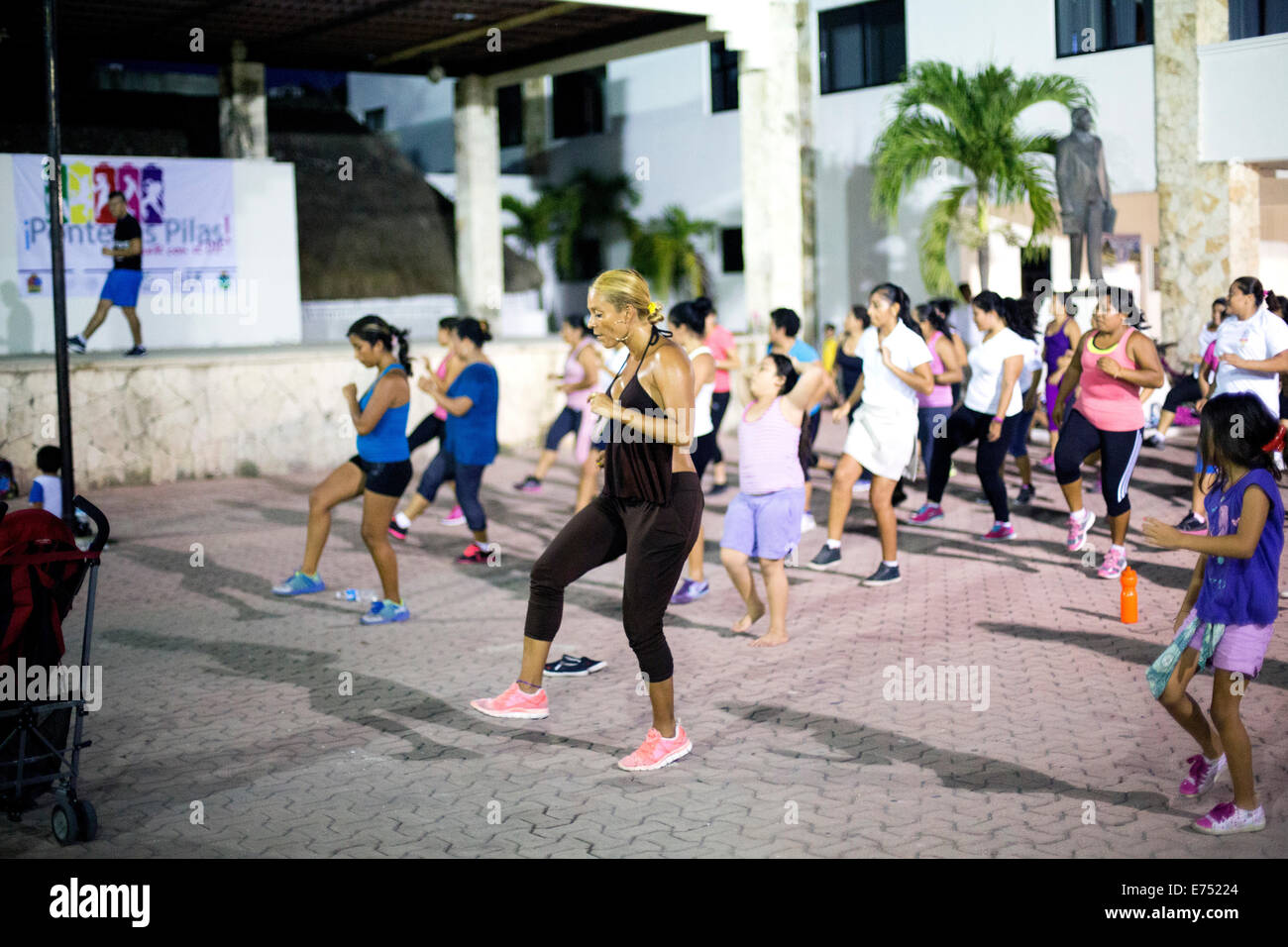 Outdoor zumba class in Mexico square with sweaty woman Stock Photo - Alamy