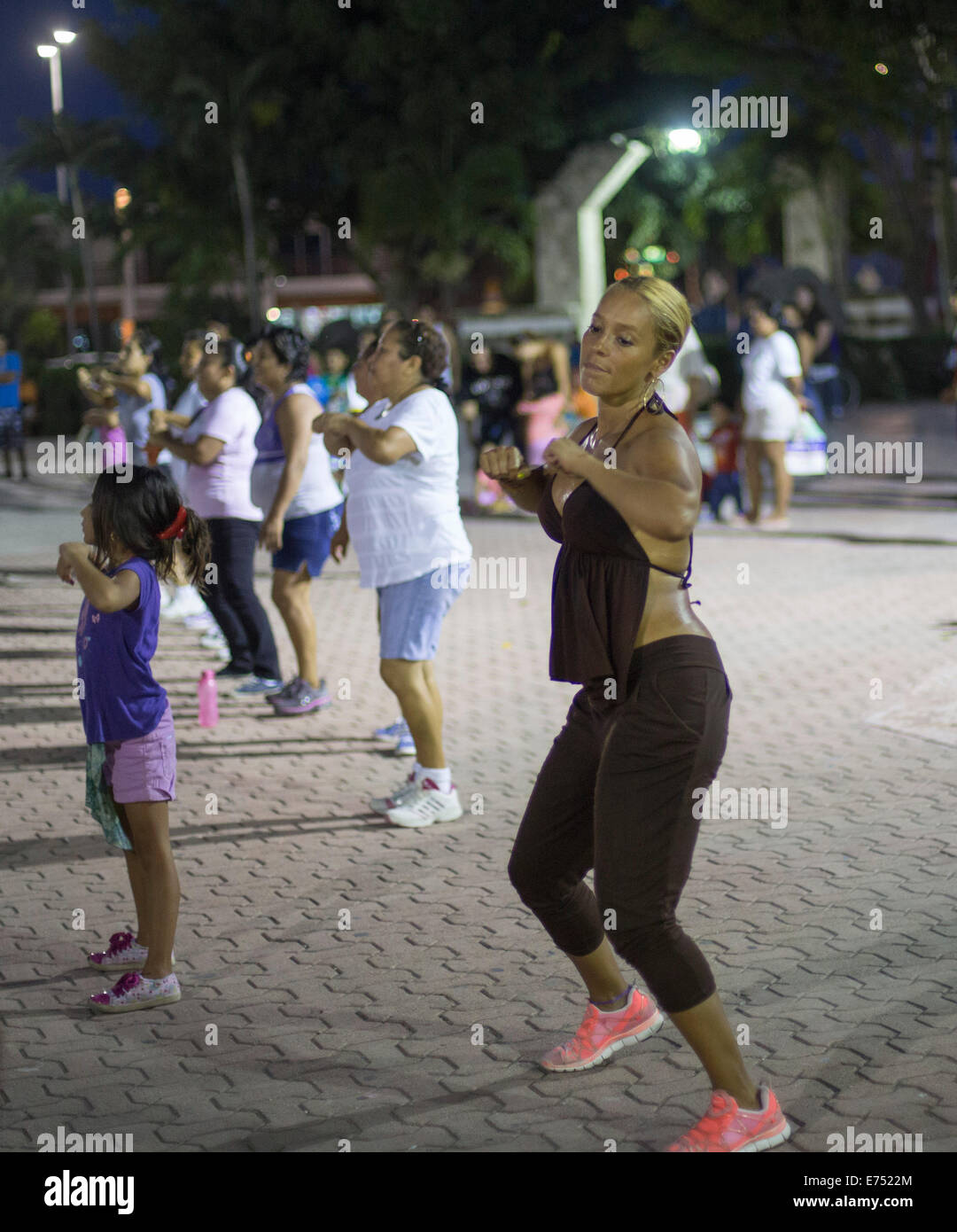 Outdoor zumba class in Mexico square with sweaty woman Stock Photo - Alamy