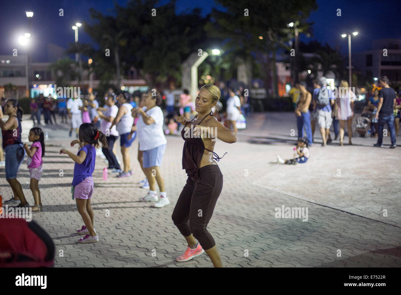 Outdoor zumba class in Mexico square with sweaty woman Stock Photo - Alamy