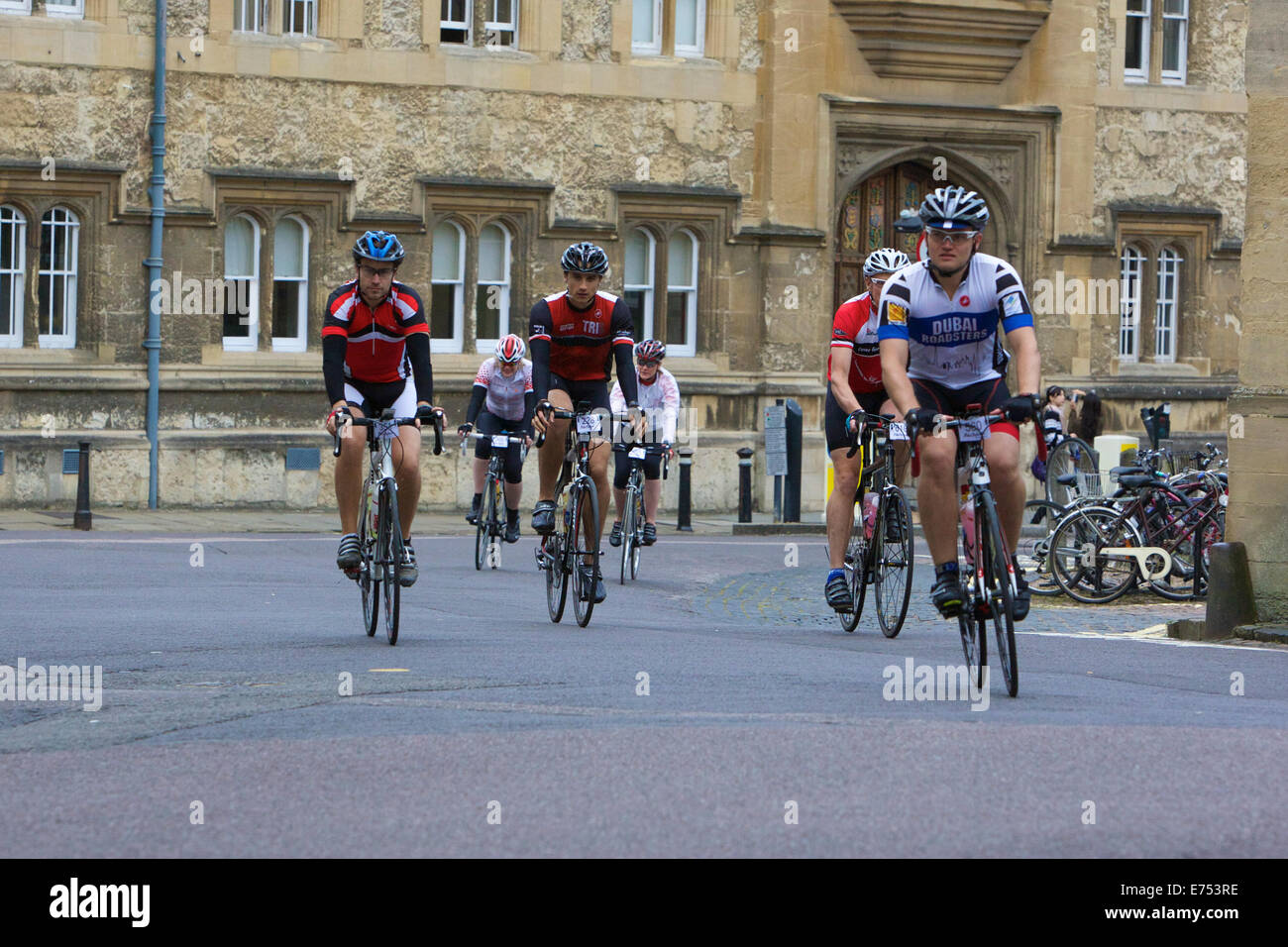 Ride rider riders cobbled street magdalen bridge river cherwell hi-res ...