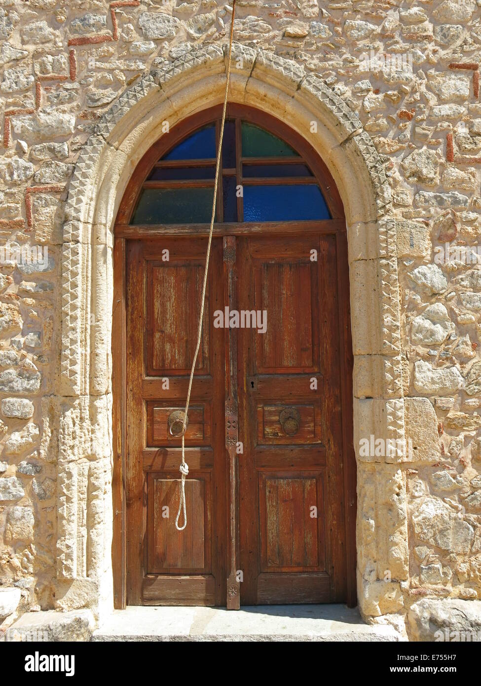 Old wooden door main entrance to a stone building Stock Photo - Alamy