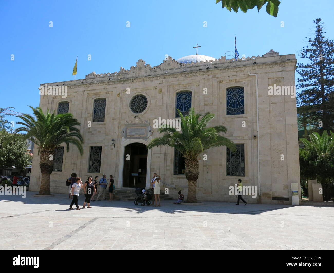 People entering Saint Titus church,situated at Heraklion,Crete,Greece ...