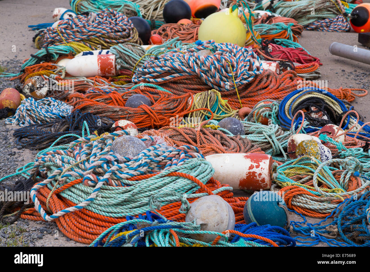 Fishing ropes and equipment during the day on the floor Stock Photo - Alamy