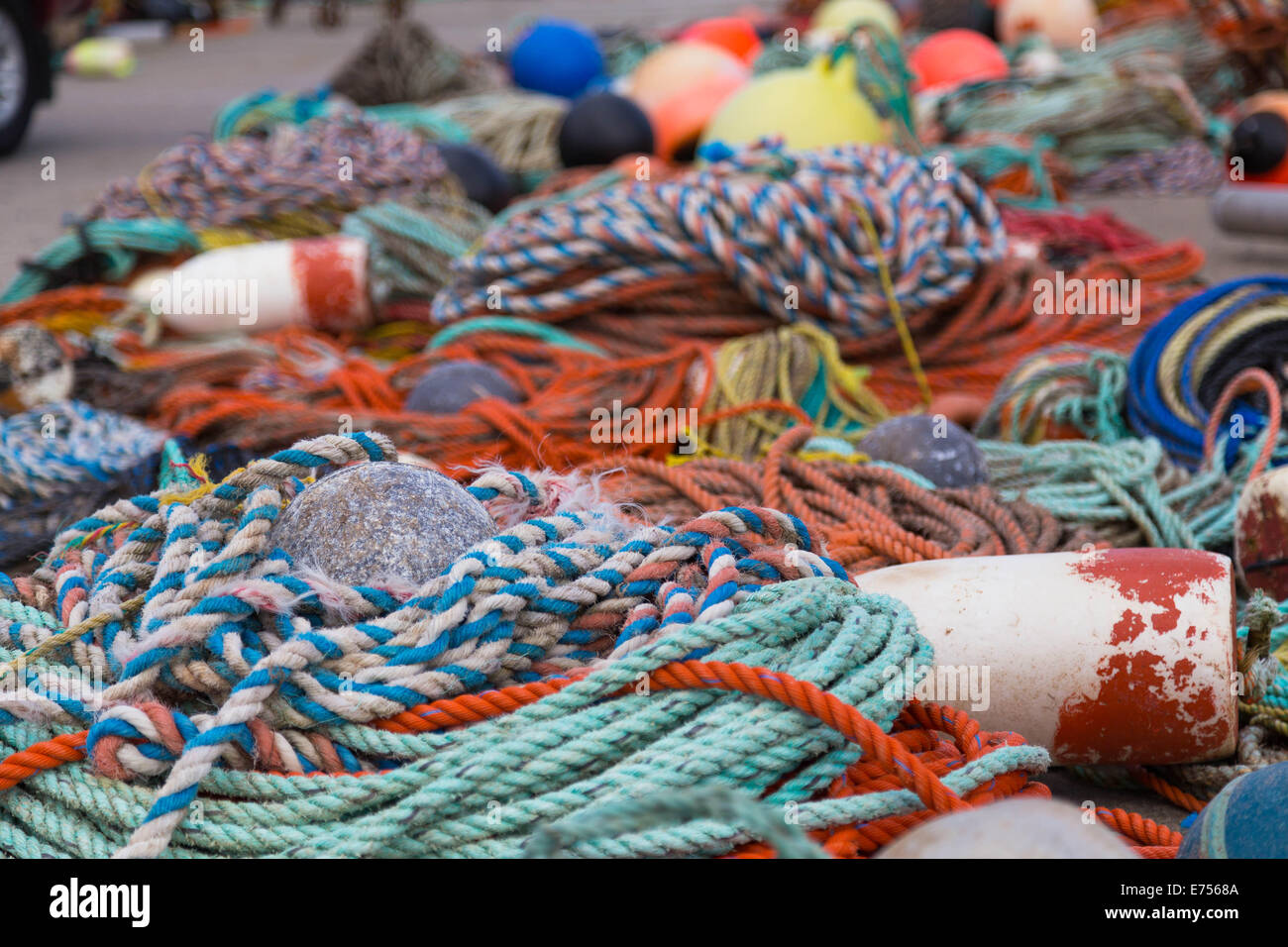 Fishing ropes and equipment during the day on the floor Stock Photo - Alamy
