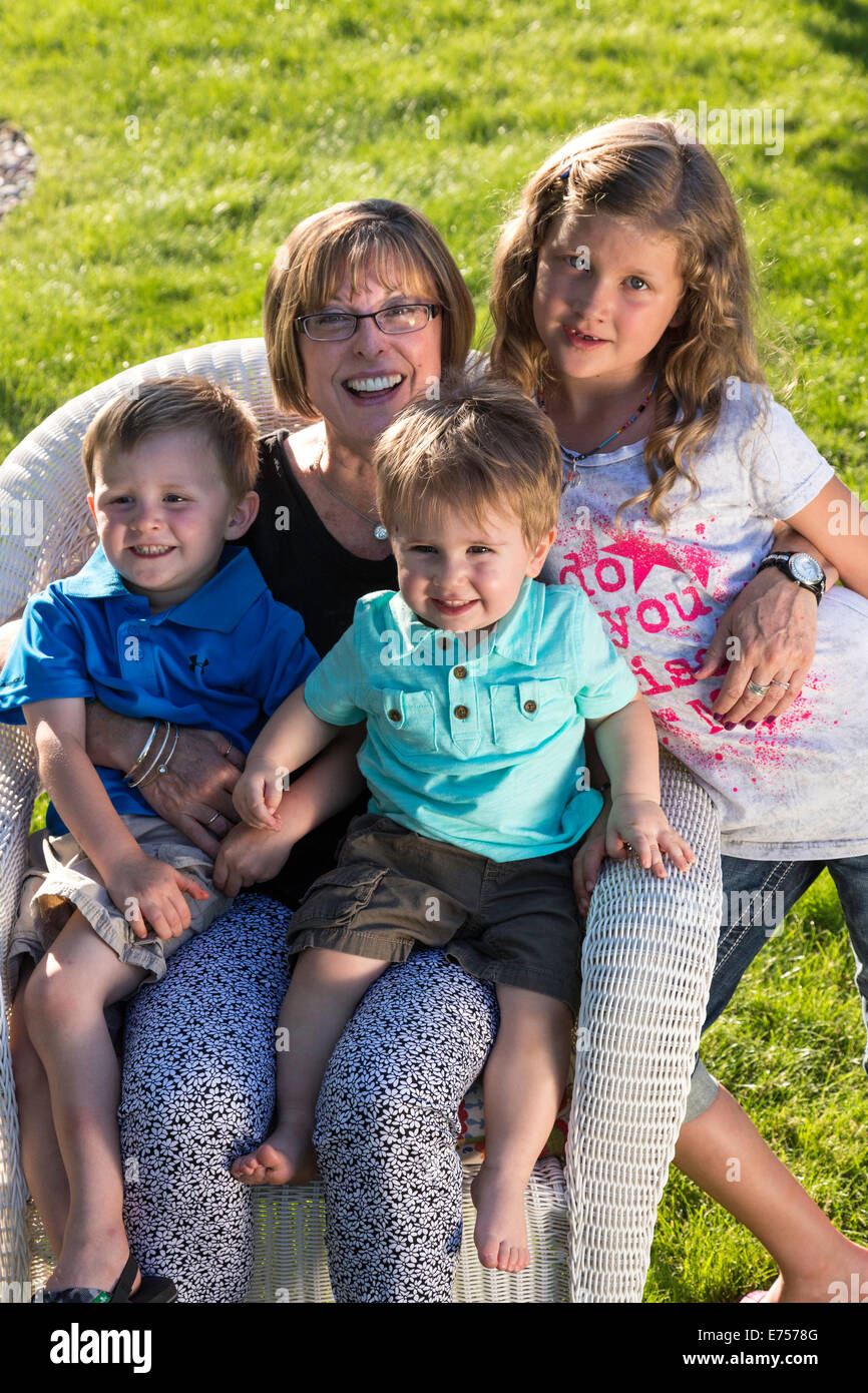 Grandmother with Her Three Grandchildren in Backyard Family Photograph ...