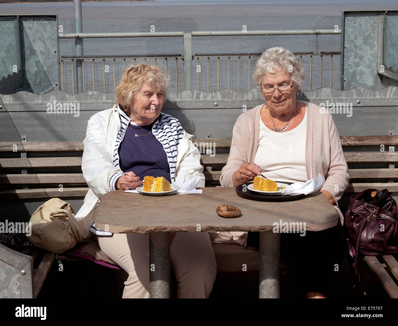 Enjoying cakes on the pier at Southwold, Suffolk Stock Photo - Alamy