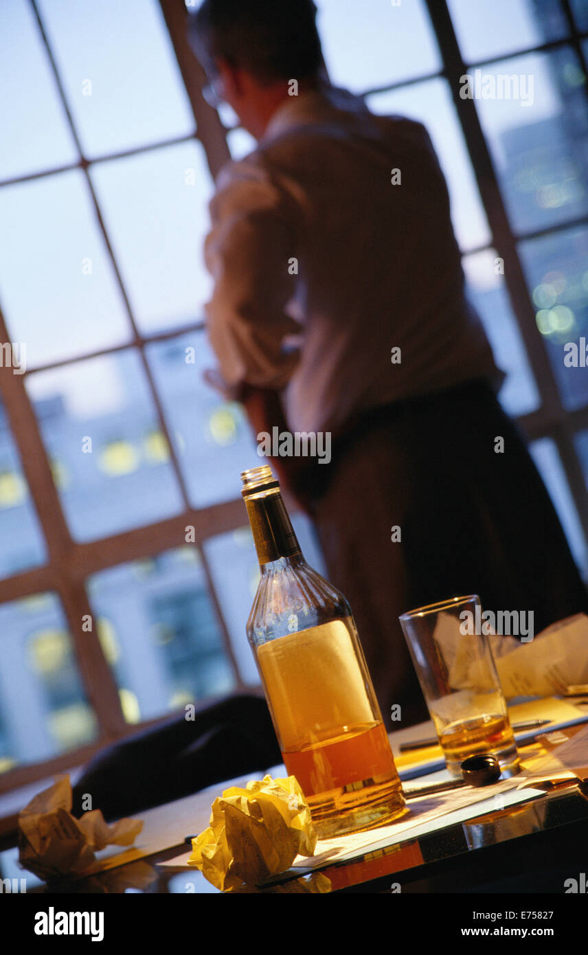Businessman Drinking Whiskey at Desk in Office, USA Stock Photo - Alamy