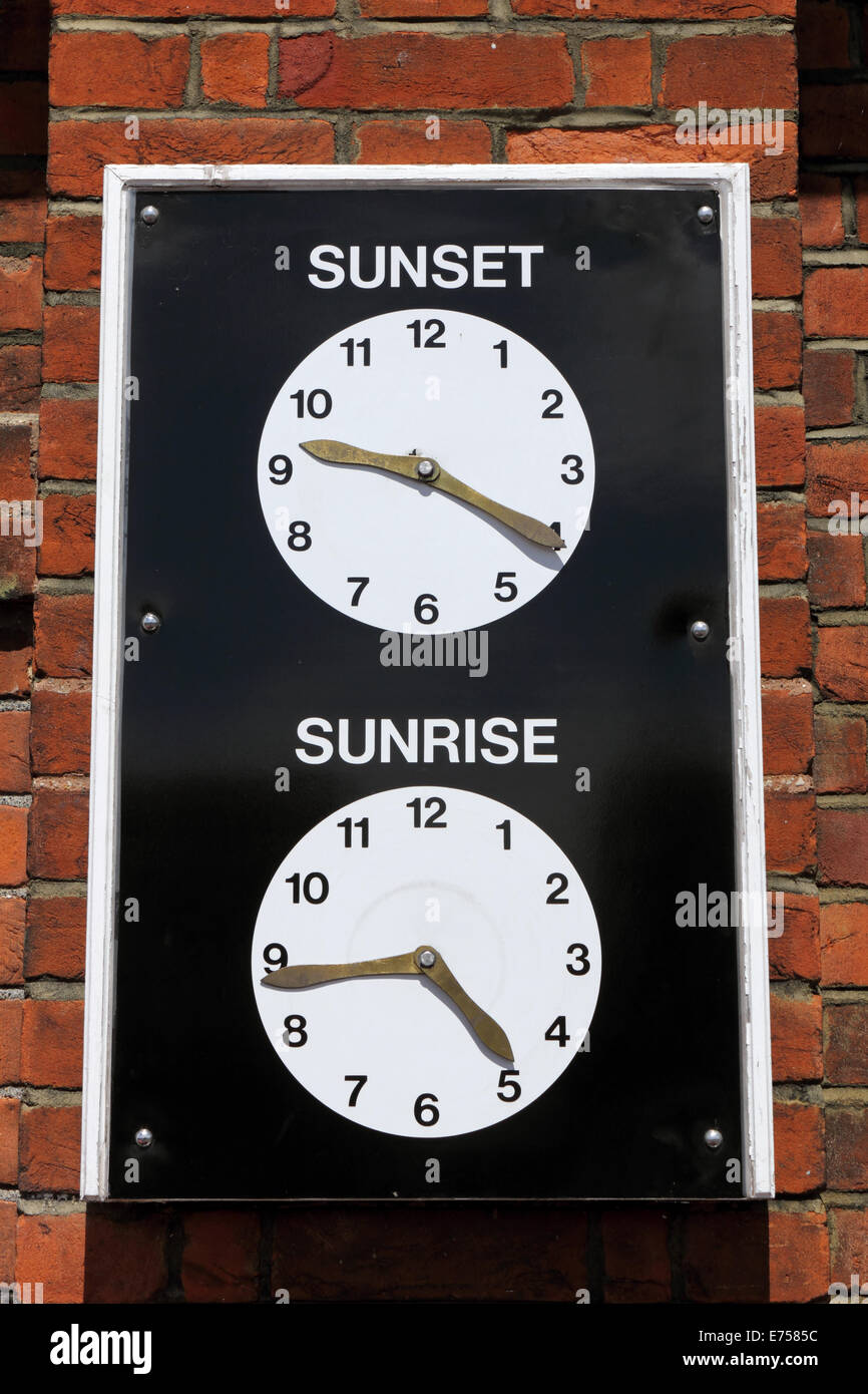 Sunrise and sunset clocks beside the River Thames at Teddington Lock ...