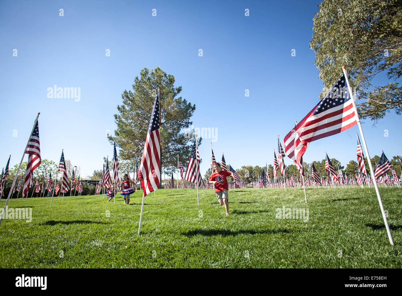 Children running through a field of American Flags in Freedom Park in ...
