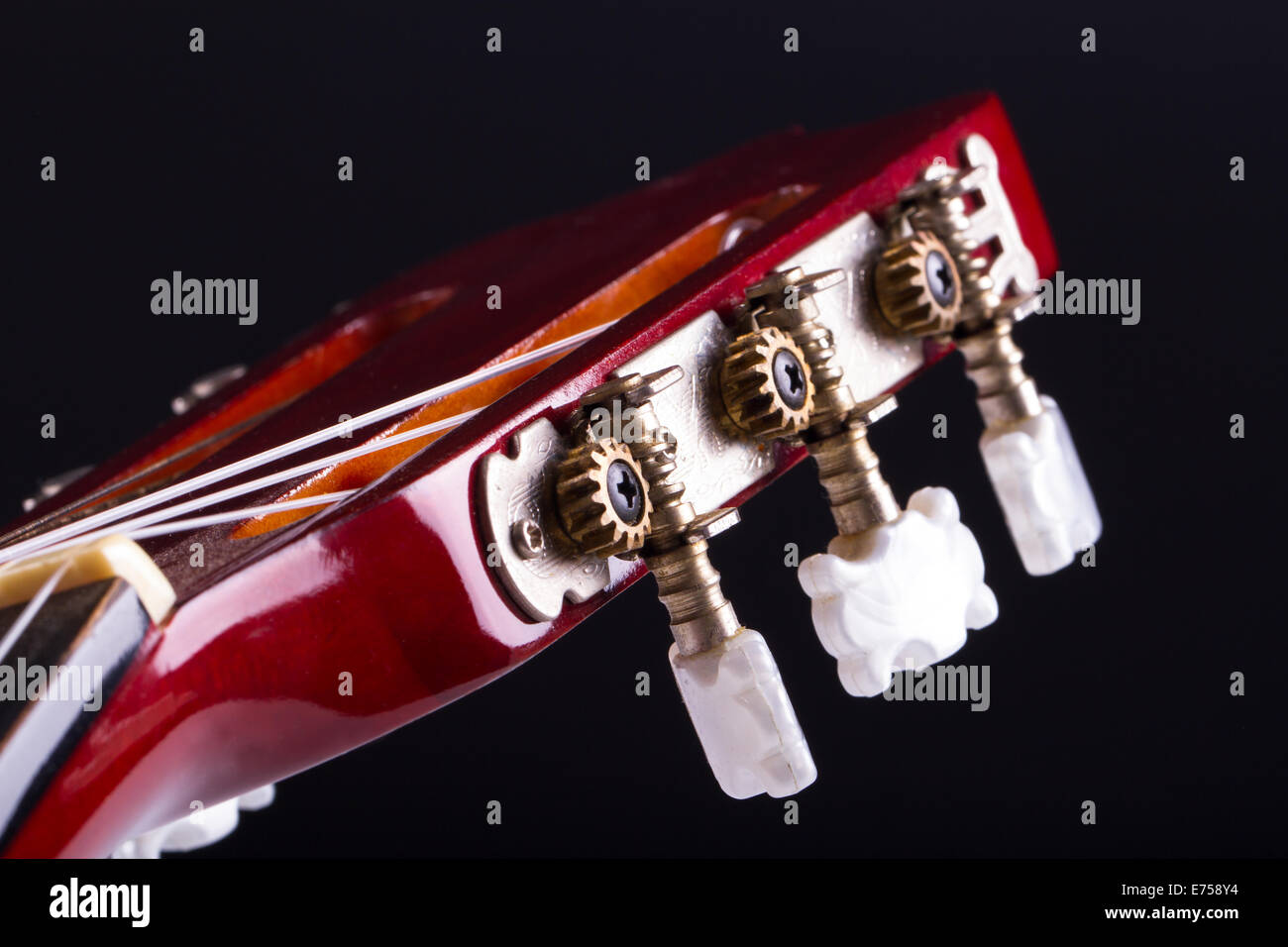 Detail view of fingerboard on classical acoustic guitar, over black ...