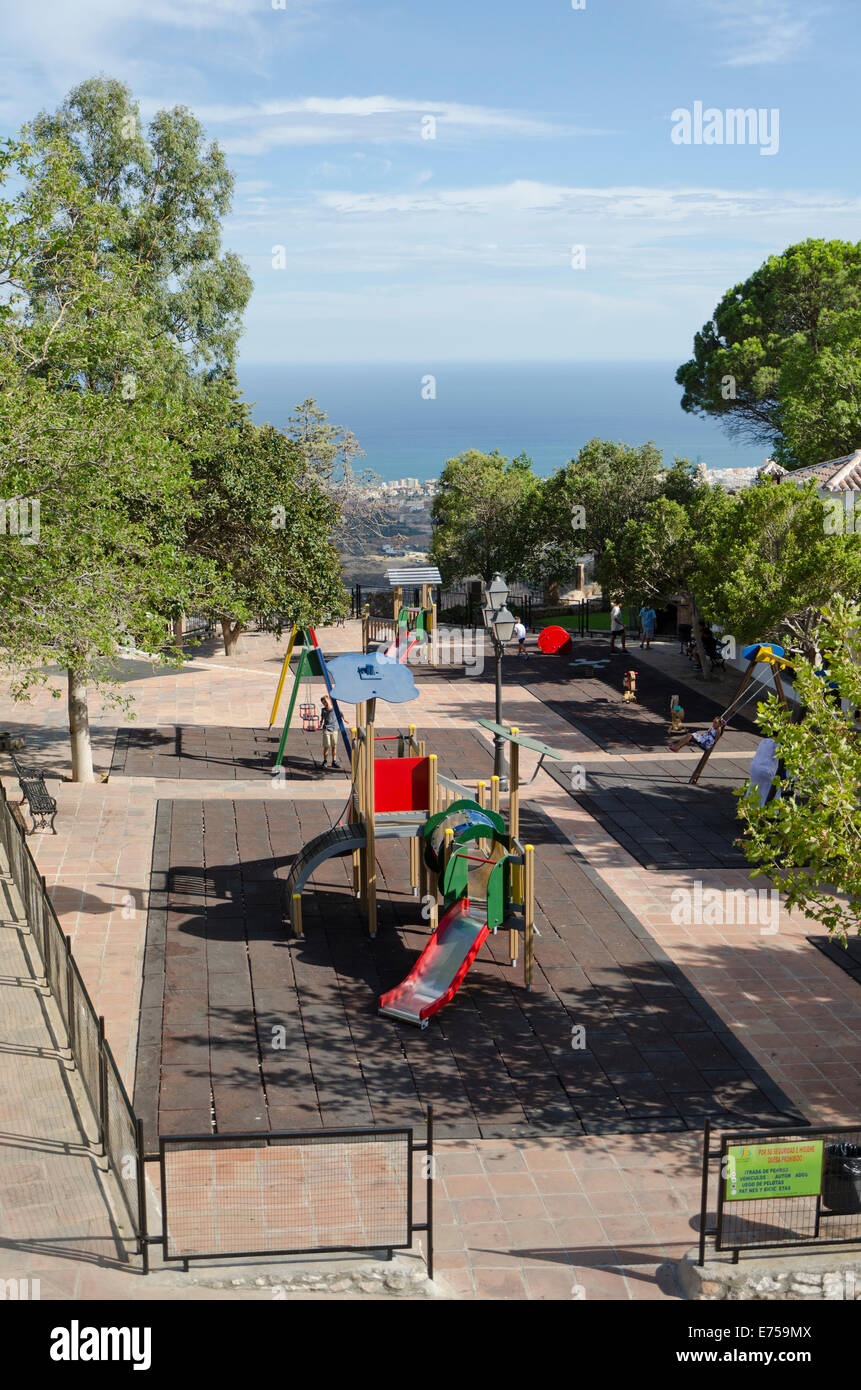 Public playground at a spanish village with Mediterranean sea in ...