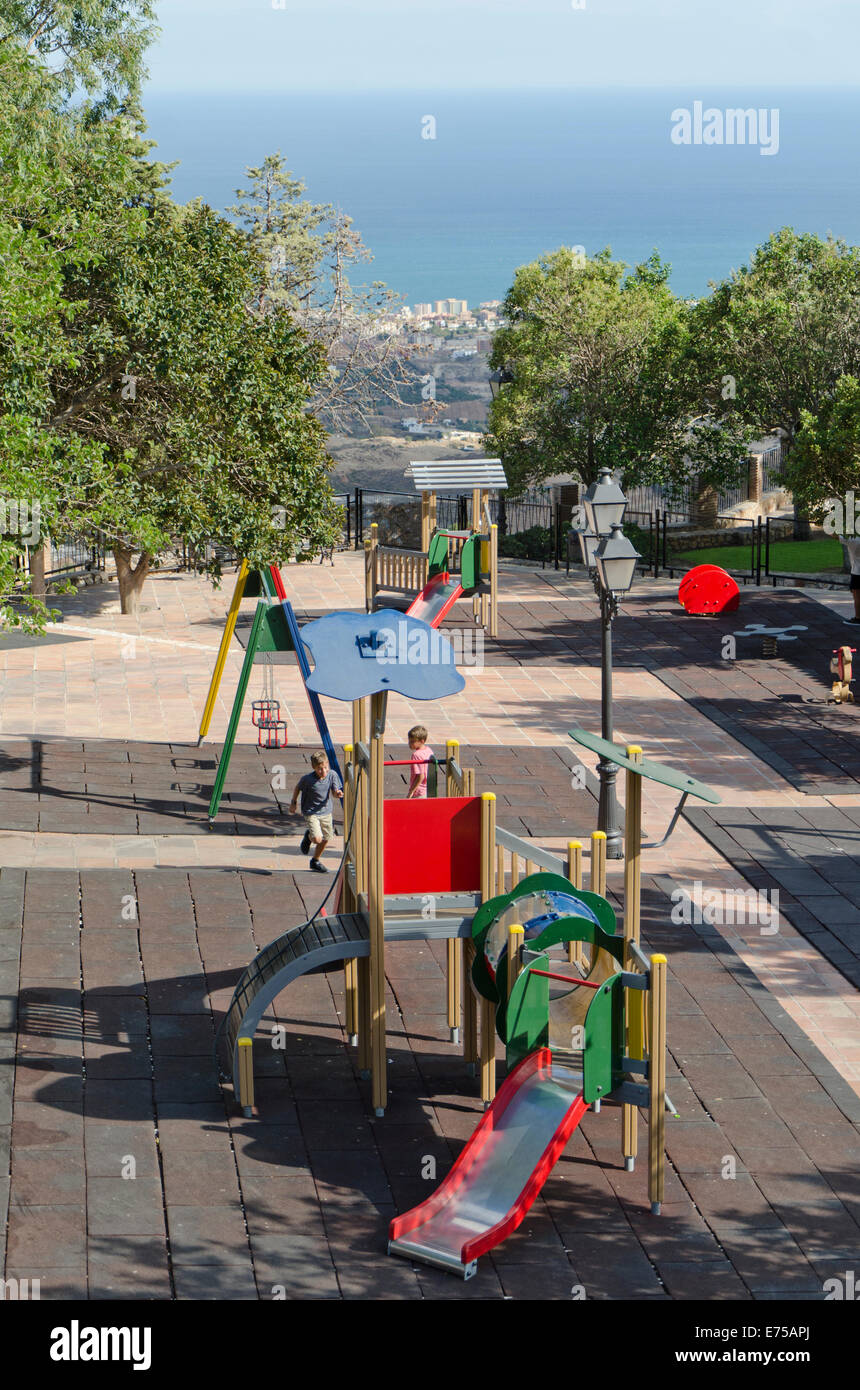 Public playground at a spanish village with Mediterranean sea in ...