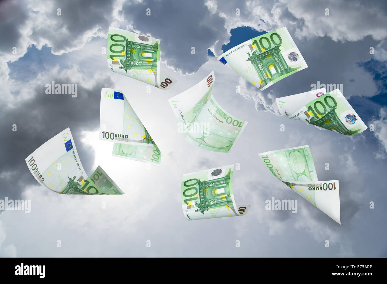 Euro banknotes falling down on cloudy sky background Stock Photo - Alamy