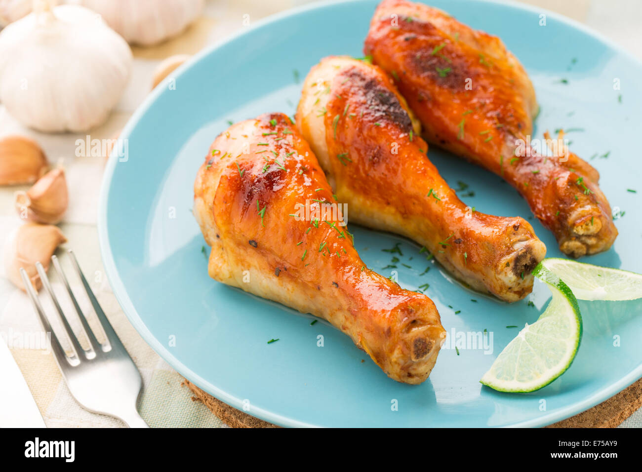 Roasted chicken legs Stock Photo - Alamy