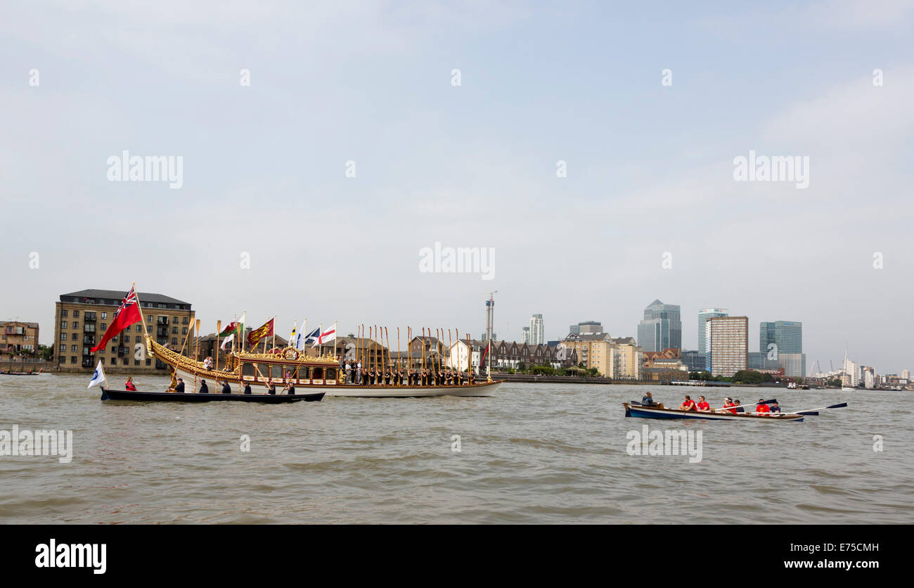 The Royal row barge Gloriana with rowing boats on the River Thames near ...