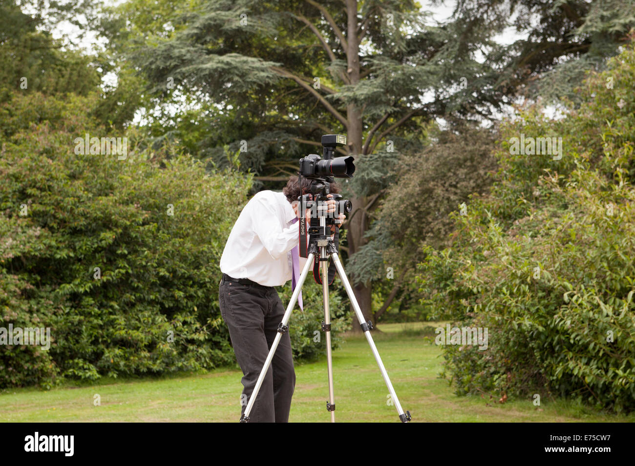 photographer and tripod Stock Photo - Alamy