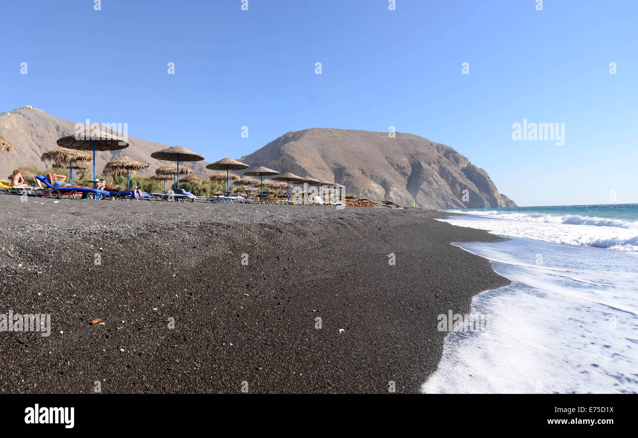 The iconic black volcanic beach at Perissa, on the world-famous ...