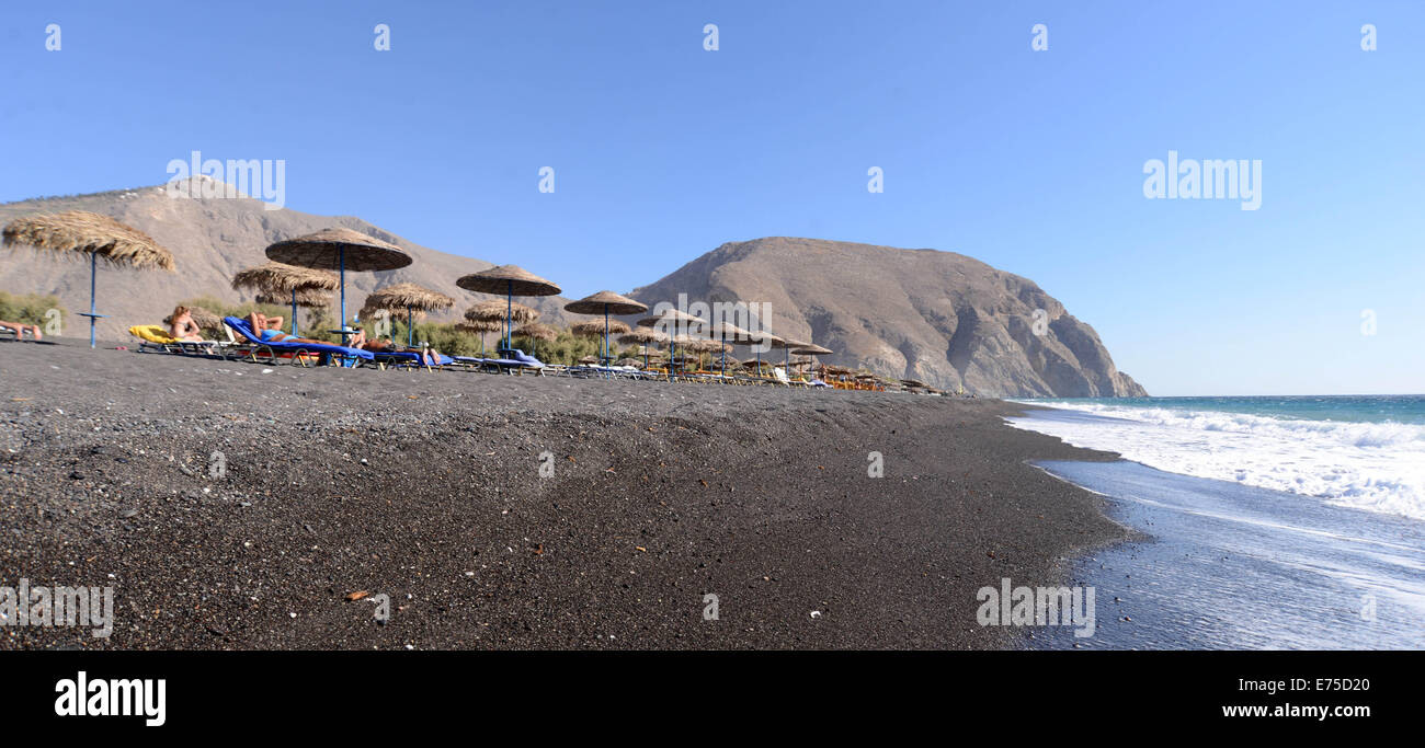 The iconic black volcanic beach at Perissa, on the world-famous ...
