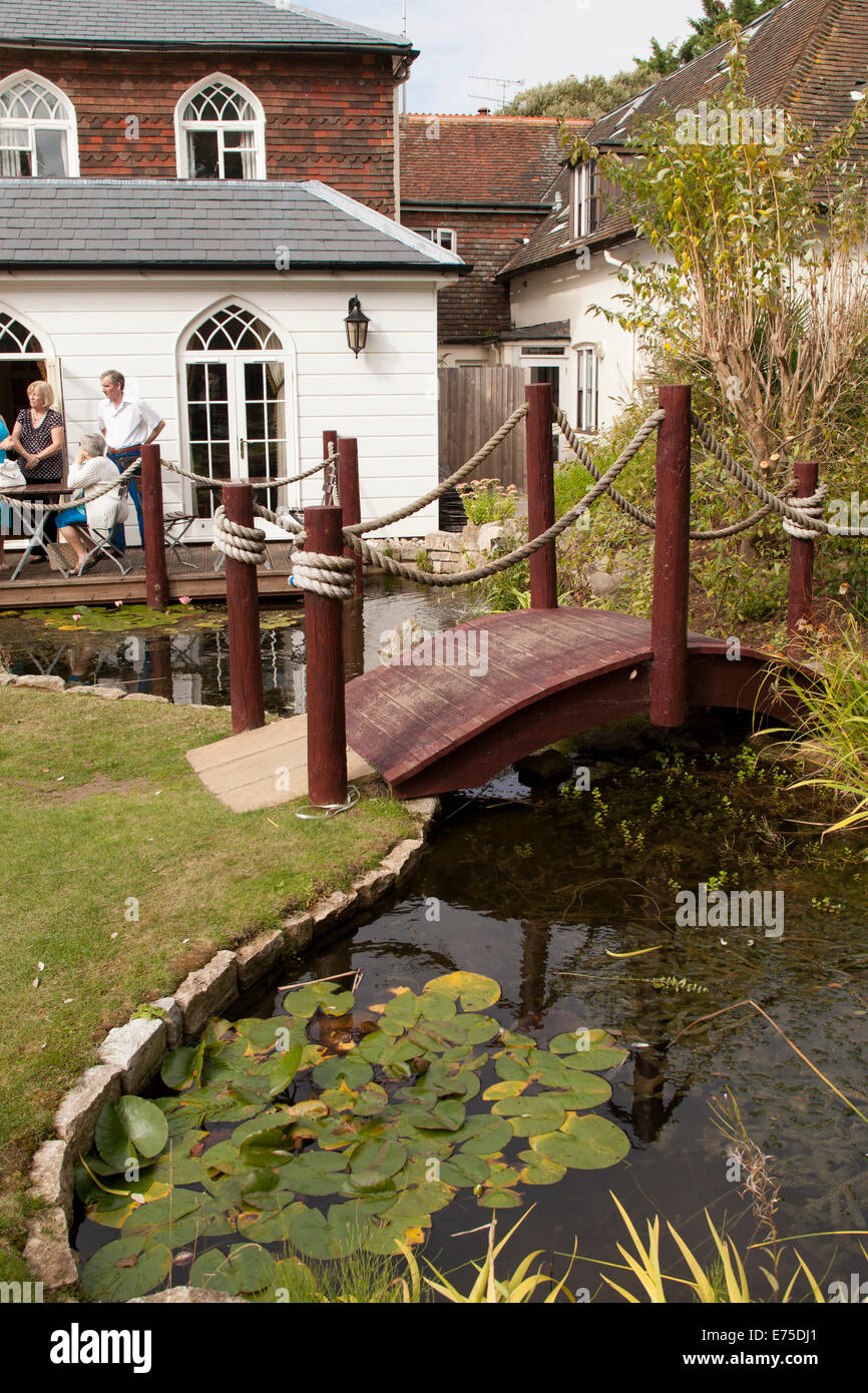 wooden bridge over pond Stock Photo - Alamy