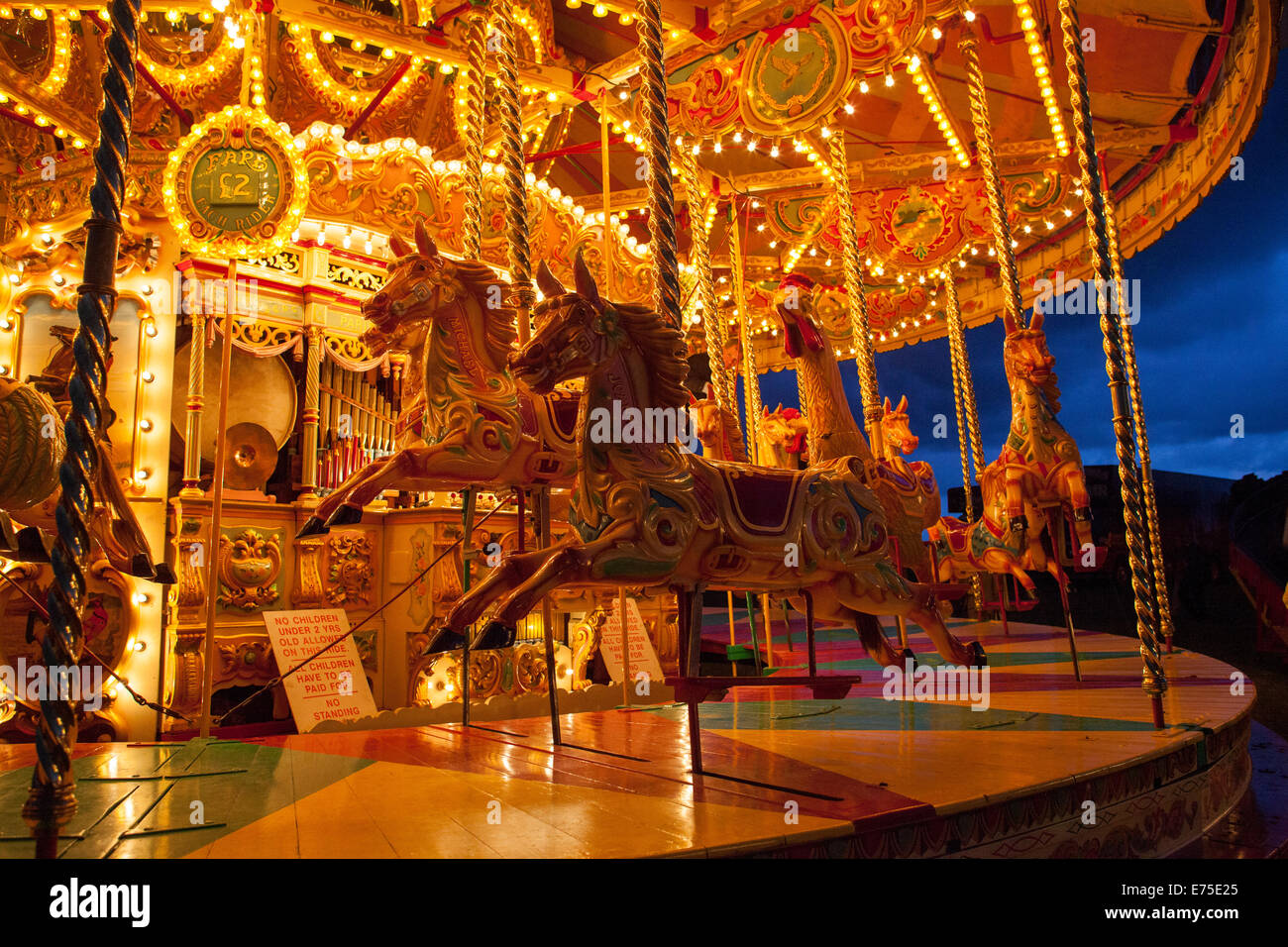 Carousel horses at night Stock Photo - Alamy