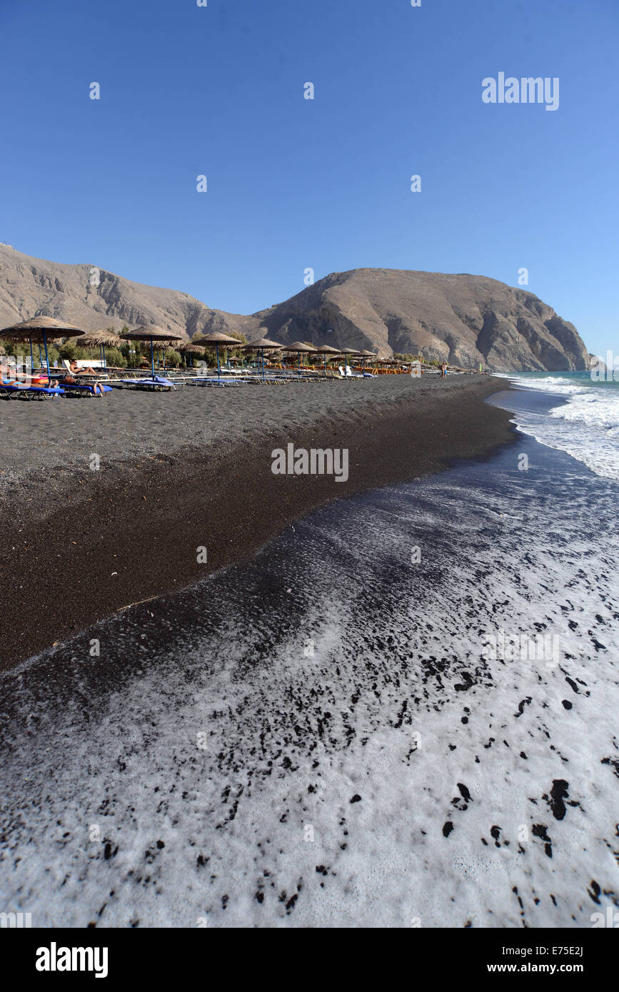The iconic black volcanic beach at Perissa, on the world-famous ...
