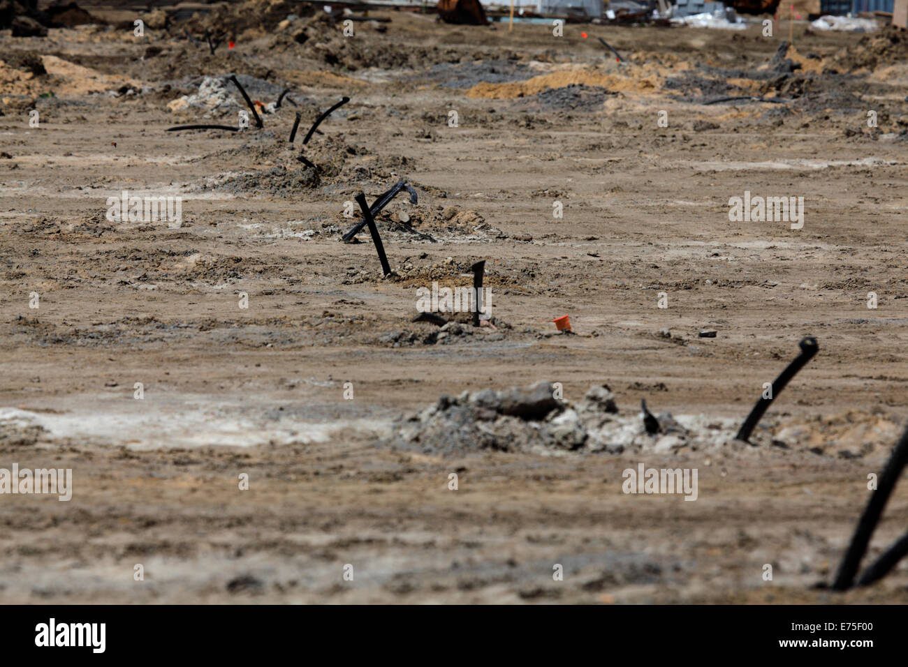Tubes protrude from the ground at a geothermal well field Stock Photo ...