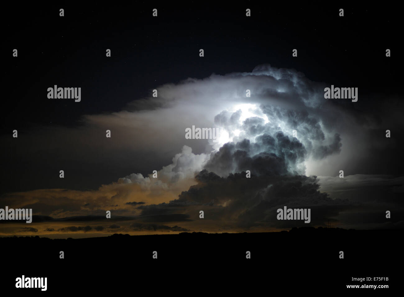 Night-time thunderstorm, illuminated by lightning Stock Photo - Alamy