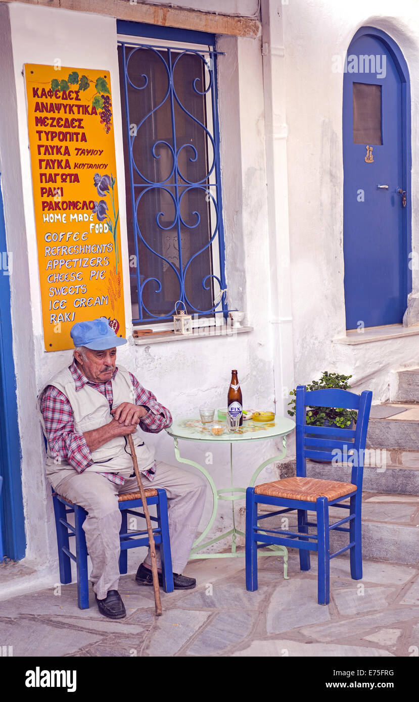 Mr. Antonis, a local frequenter in a traditional Greek café (kafeneio ...