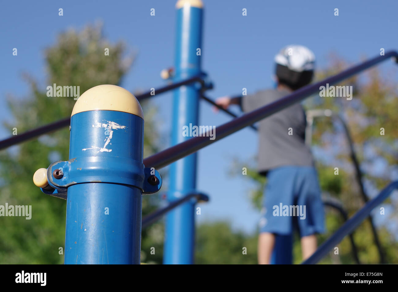 Schoolyard playground - side view of the stairs handrails with playing ...
