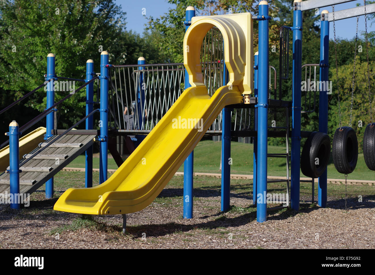 View of schoolyard playground - side view of the slide Stock Photo - Alamy