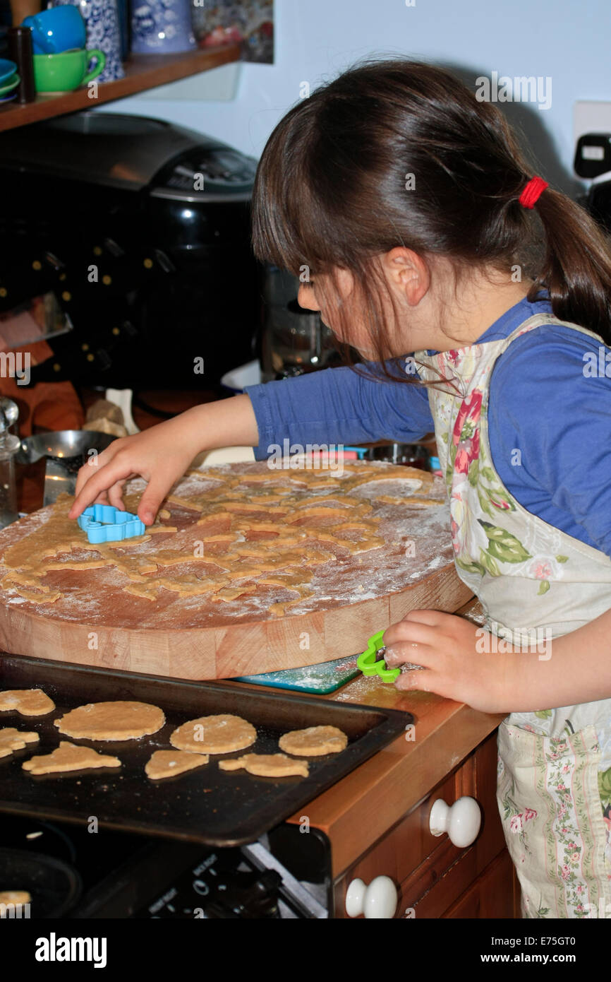 Child making biscuits Stock Photo - Alamy