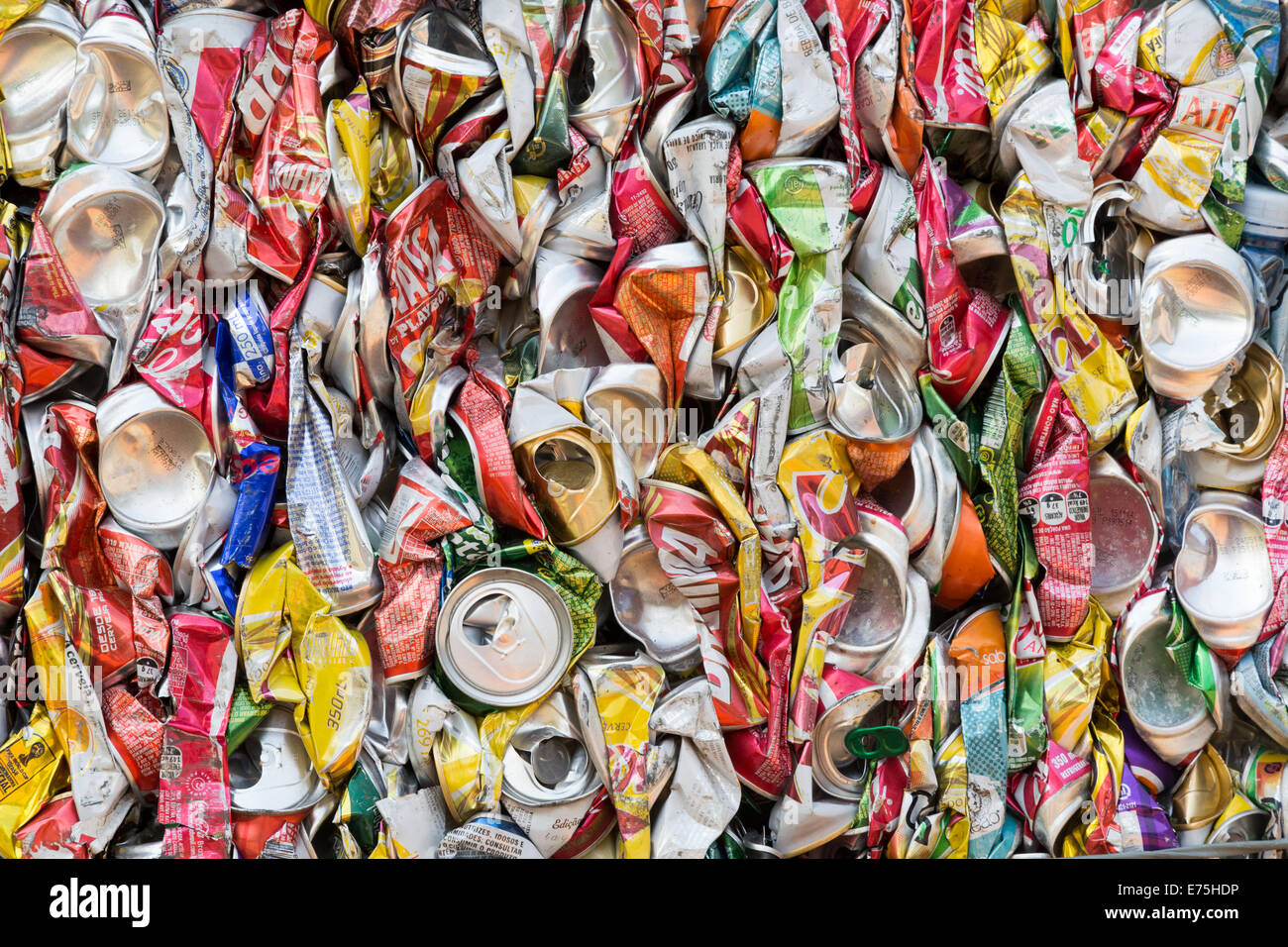 Flattened and compressed cubes of aluminum cans. Aluminum trash ...