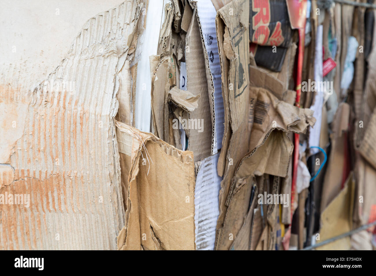 Flattened and compressed cubes of cardboard. Cardboard trash compressed ...