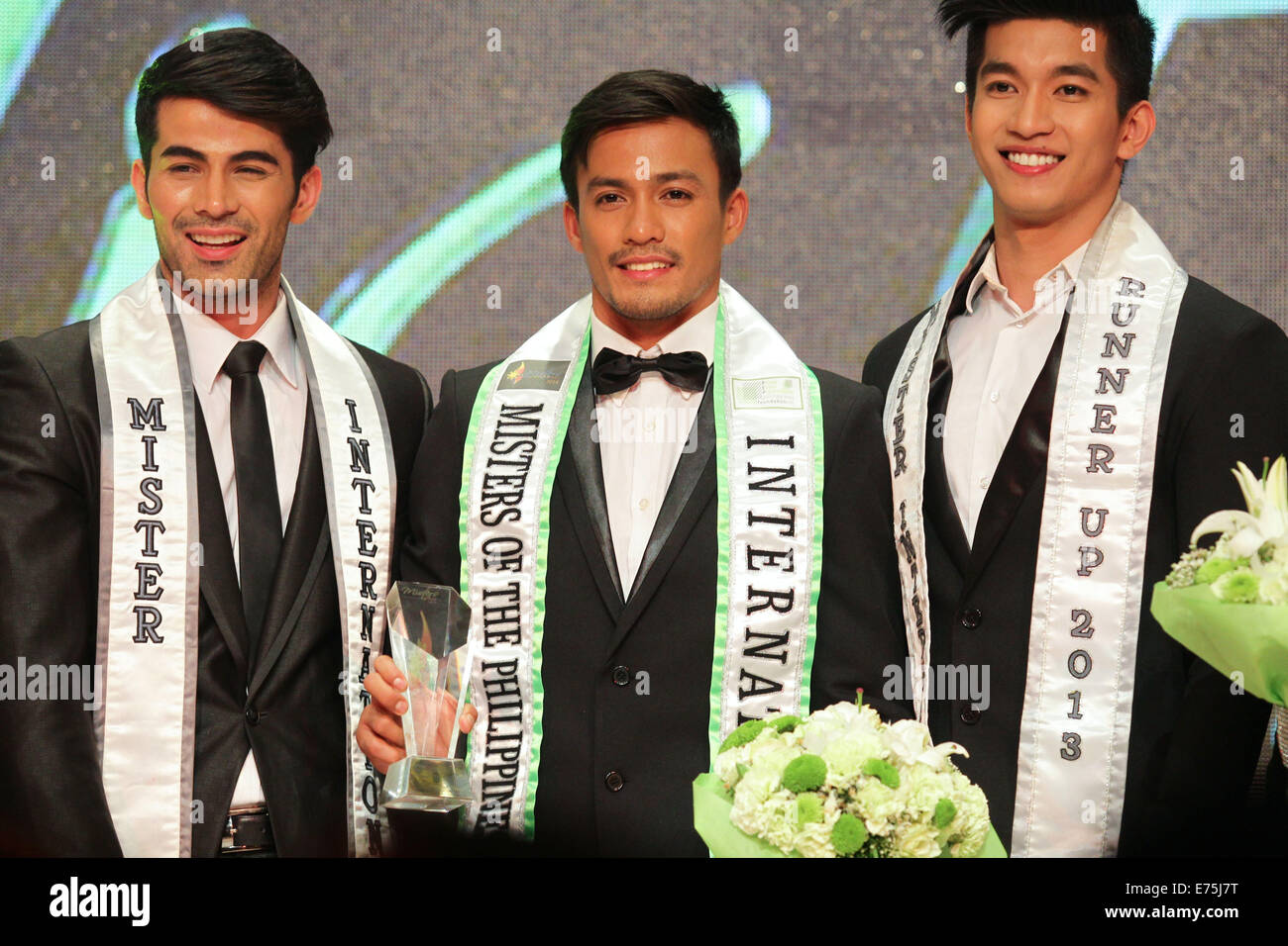 Neil Perez (C) with Mister International 2013 Jose Paredes from Venezuela (L) and Mister ...