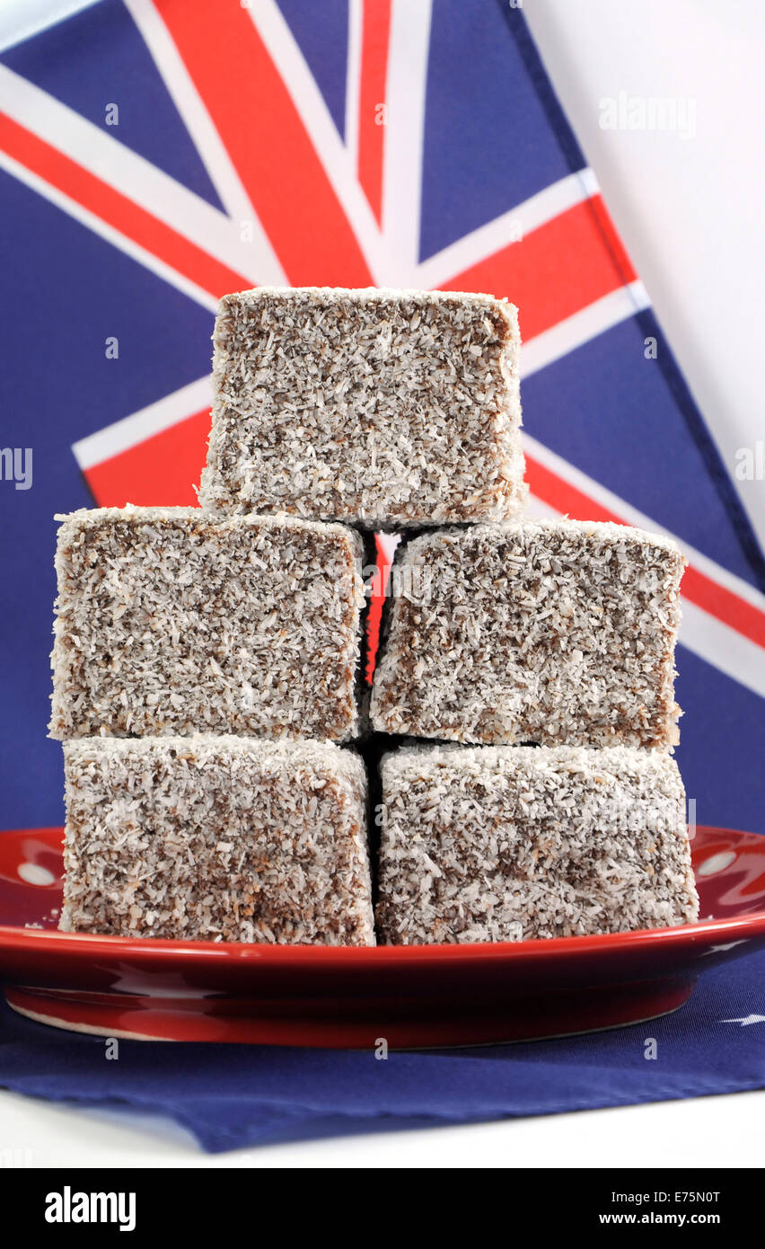 Australian traditional cake, Lamingtons, on red polka dot plate with ...