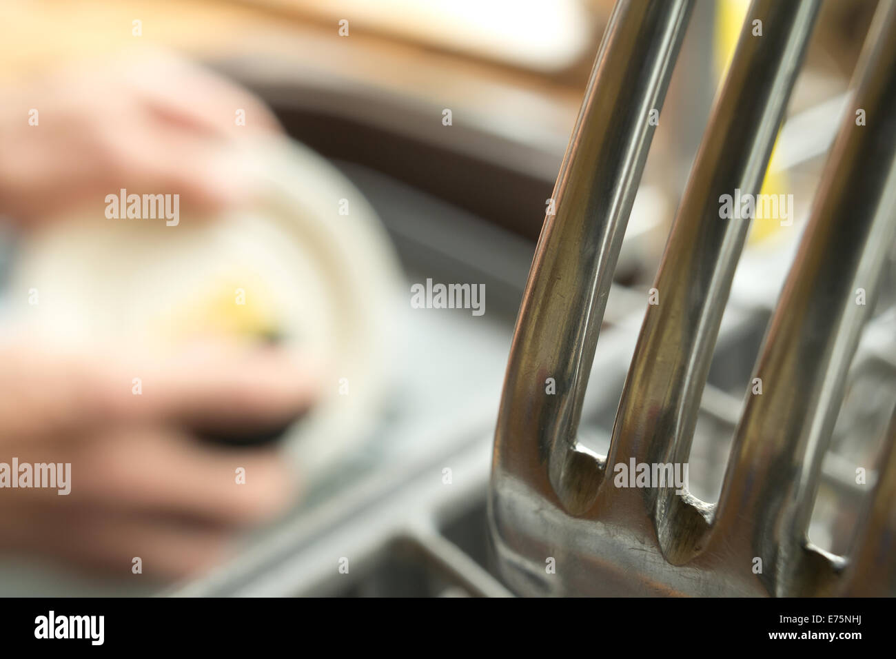 stainless steel metal fork like prison bars of prison chained to ...