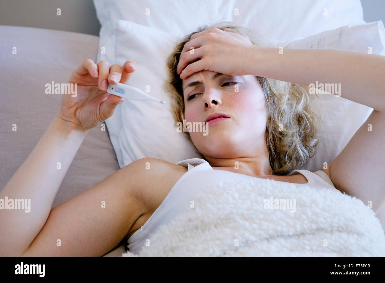 Woman with fever Stock Photo - Alamy