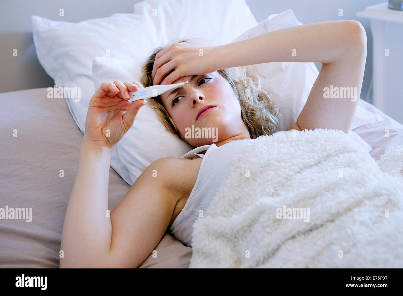 Woman with fever Stock Photo - Alamy