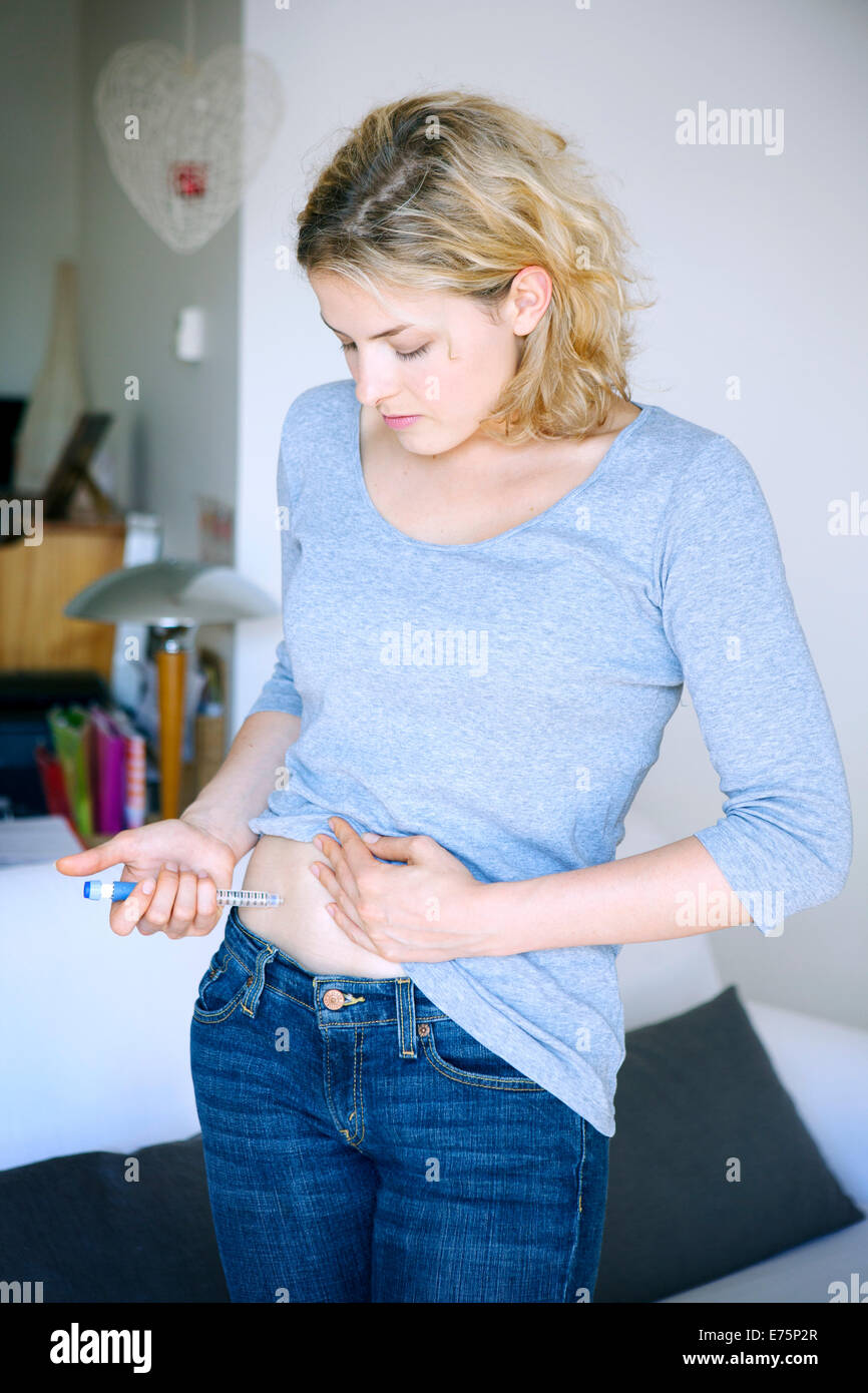 Treating diabetes, woman Stock Photo - Alamy