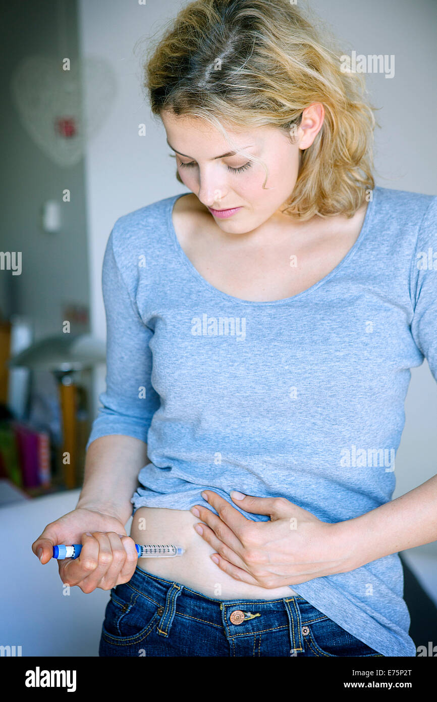 Treating diabetes, woman Stock Photo - Alamy