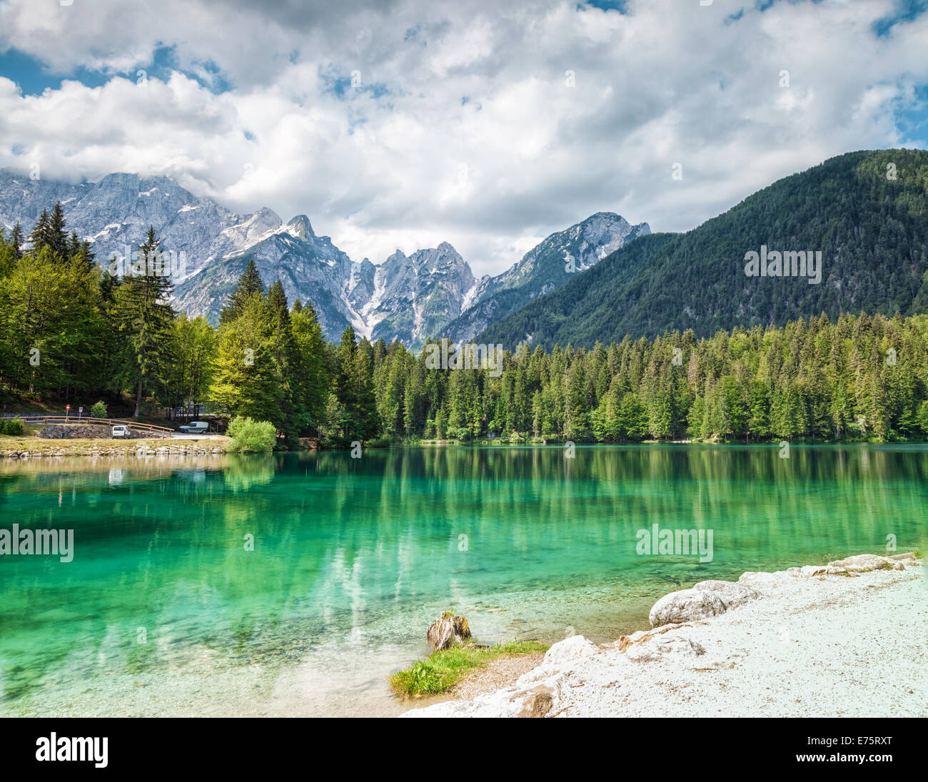 Lake Fusine with crystal clear water in the Italian Alps Stock Photo ...