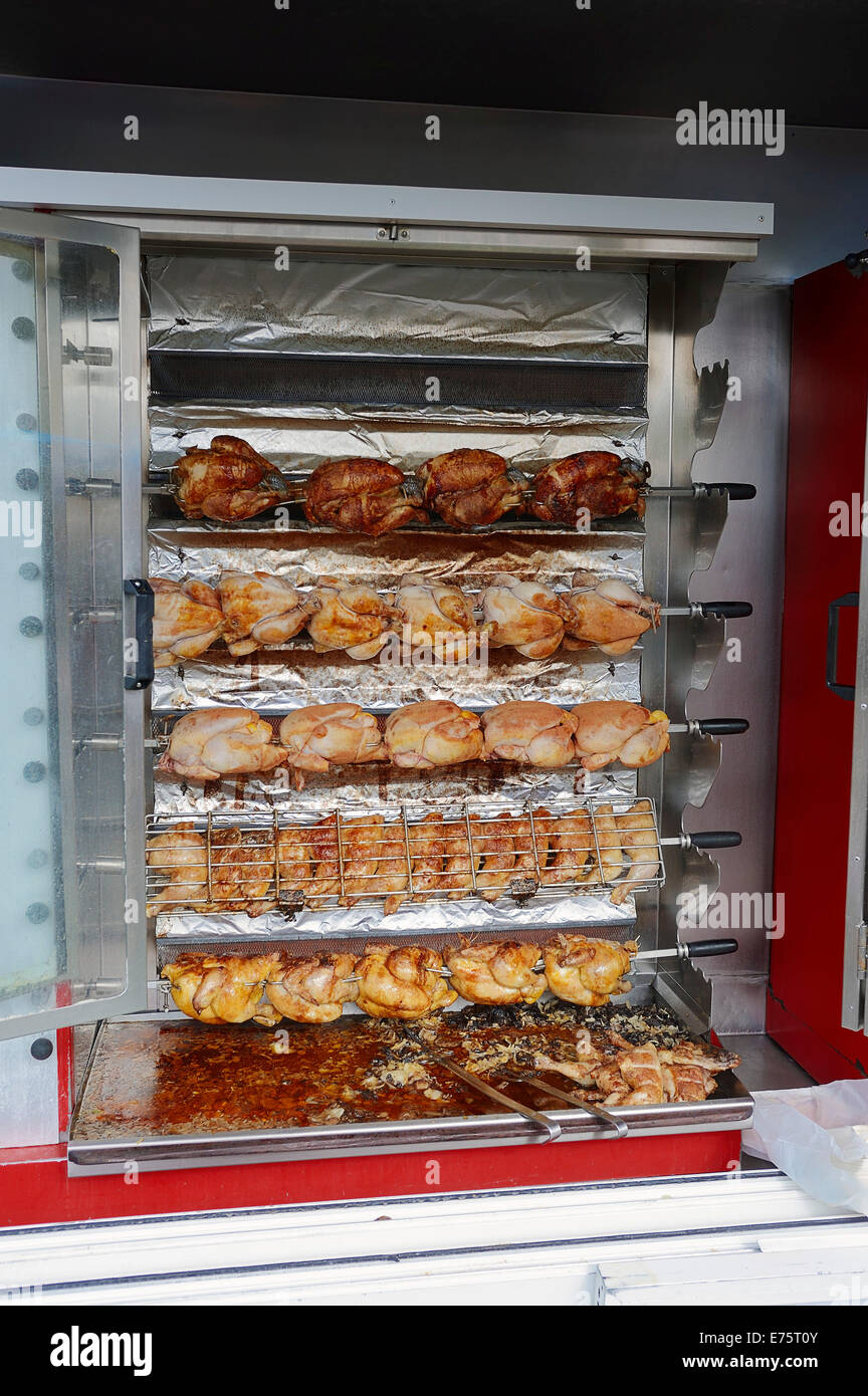 Market stall with a chicken grill and fried chicken, Bédoin, Vaucluse ...