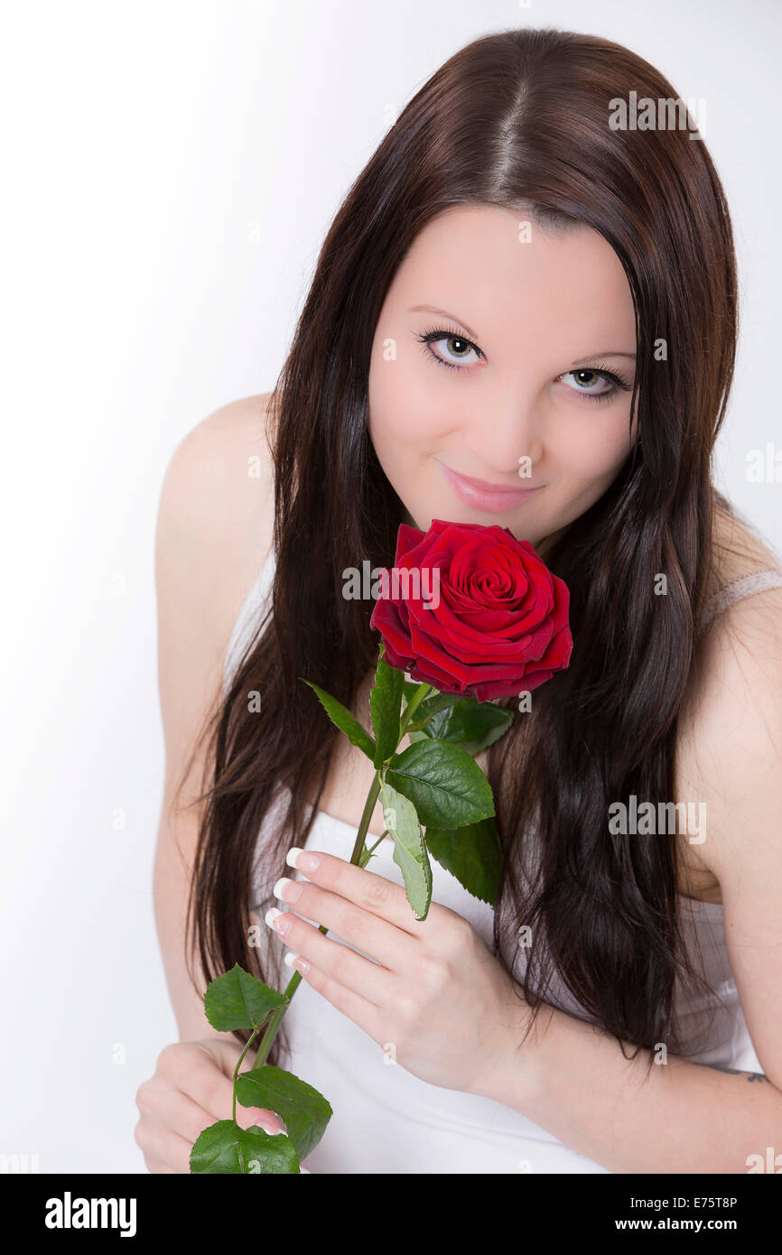 Young woman with a red rose Stock Photo - Alamy