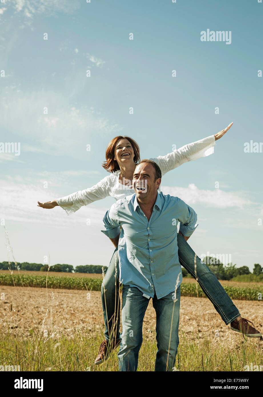 Couple piggyback carry hi-res stock photography and images - Alamy