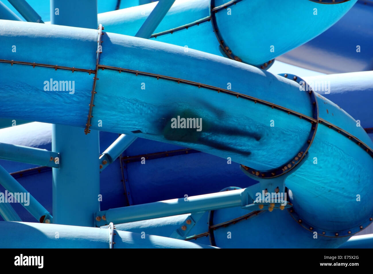 Person sliding down a water slide Stock Photo - Alamy