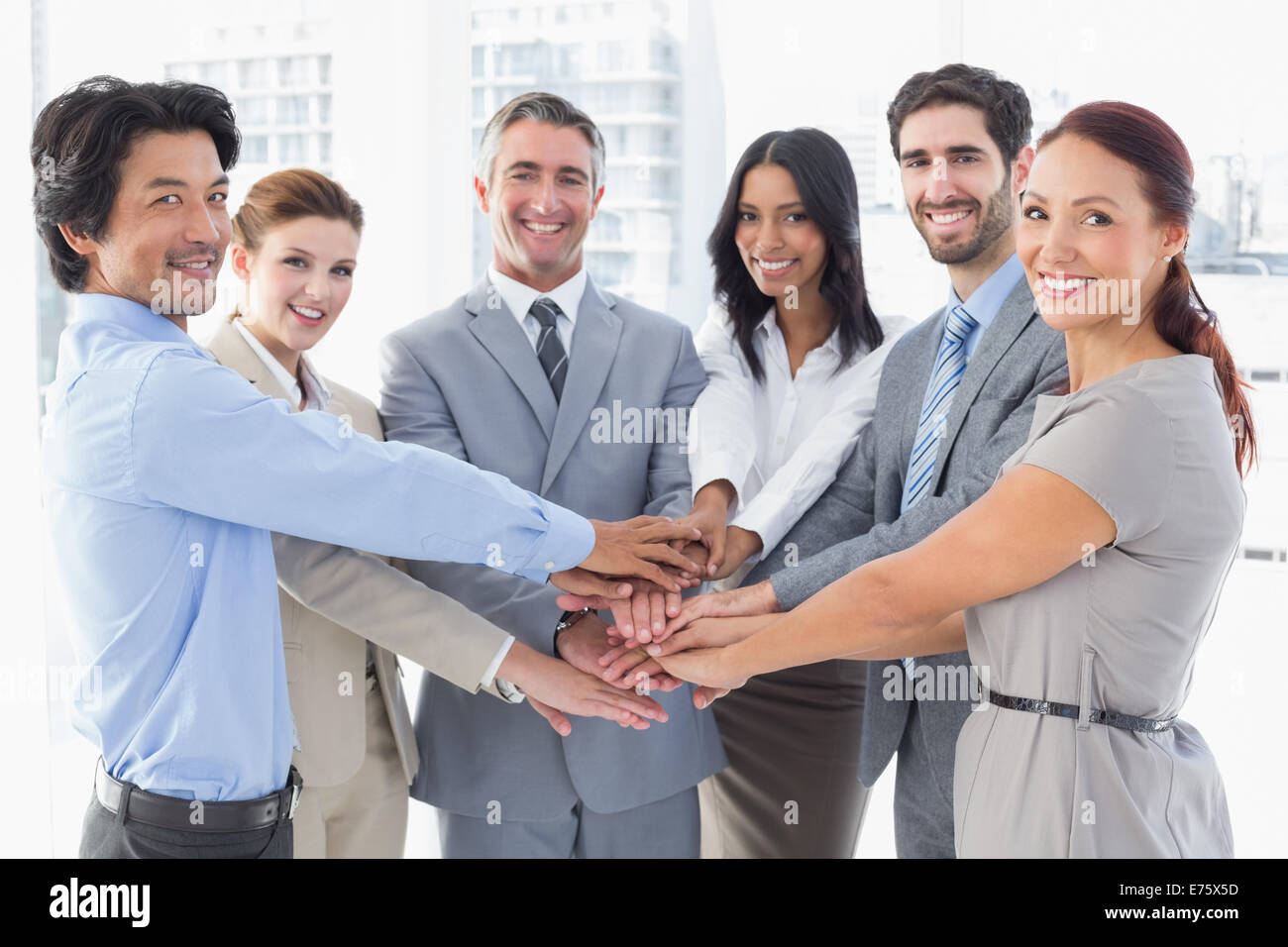 Business team stacking their hands Stock Photo - Alamy