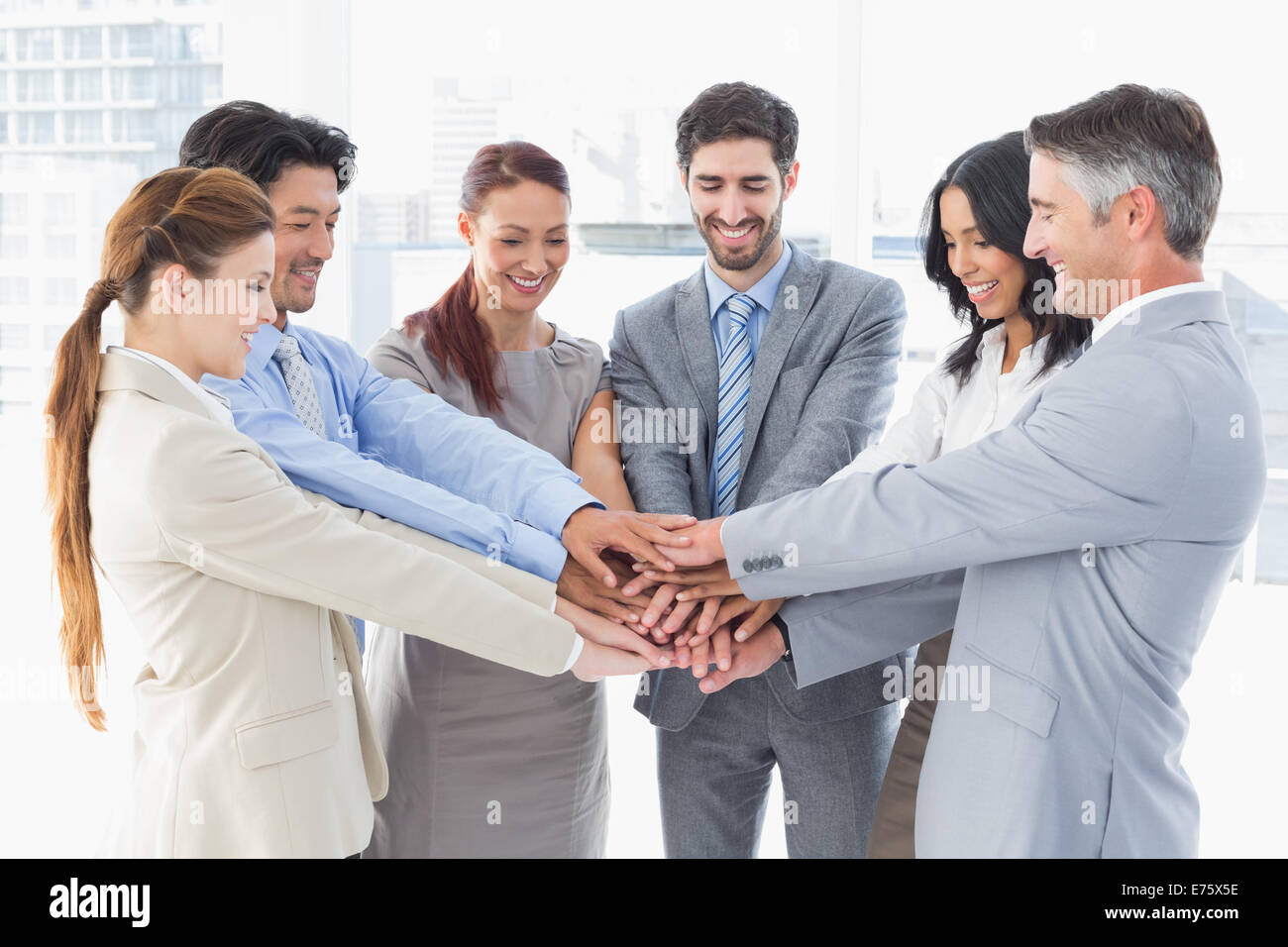 Business team stacking their hands Stock Photo - Alamy